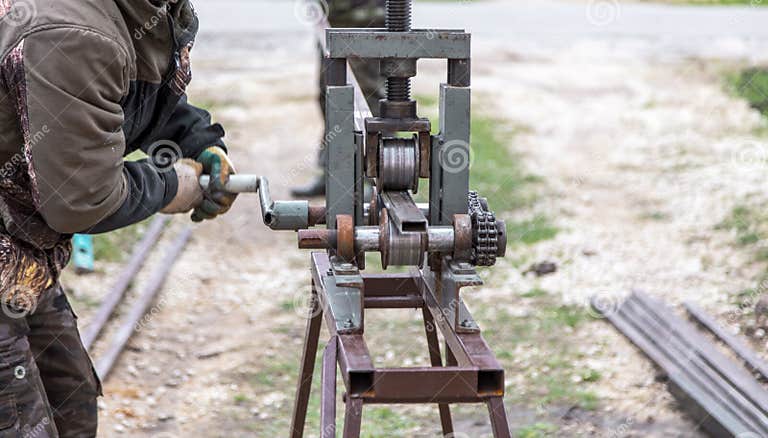 Workers Bend Metal in a Pipe Bender. Stock Image - Image of work ...
