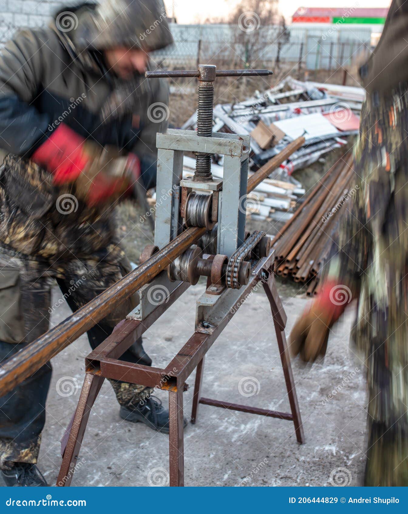 Workers Bending Metal at a Construction Site. Technology Stock Image ...