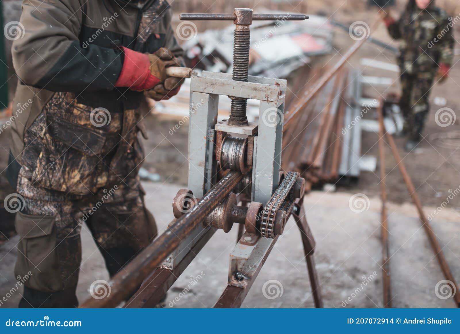 Workers Bending Metal at a Construction Site. Technology Stock Photo ...
