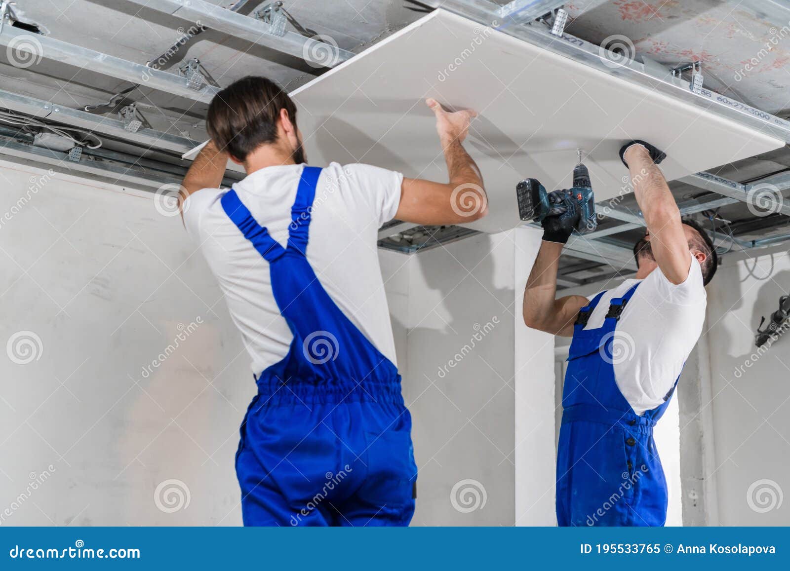 Carpenters are Assembling a Plasterboard Ceiling Using a Drill Stock ...