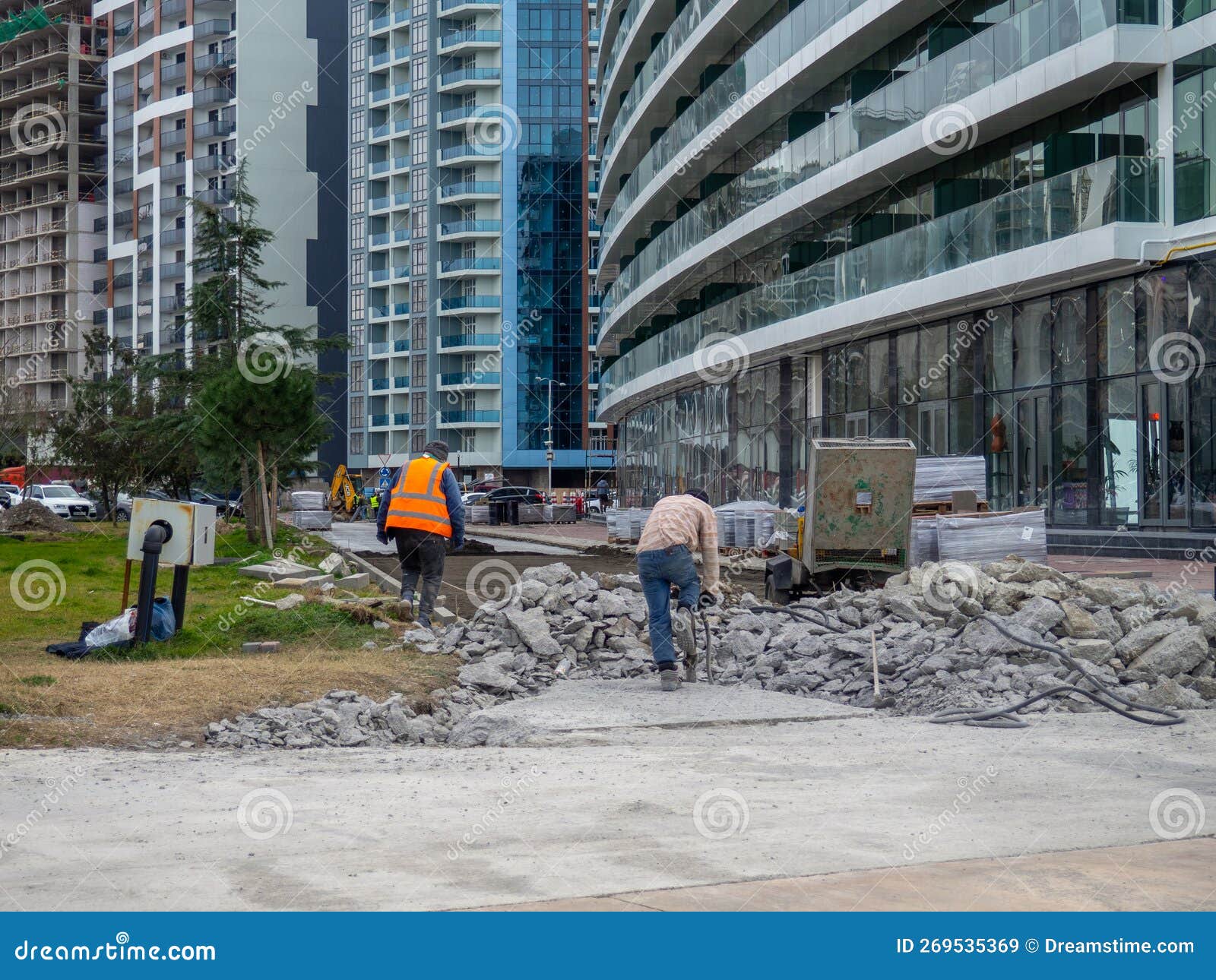 Workers Break Off Concrete. Hard Work. People are Reconstructing the ...