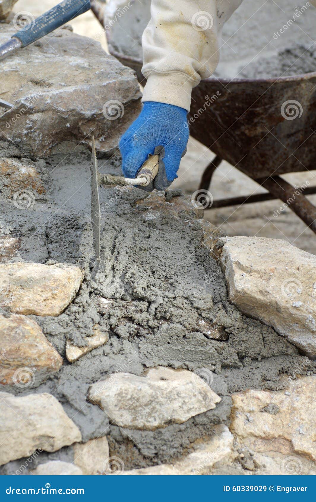Workers build a stone wall stock image. Image of stonework - 60339029
