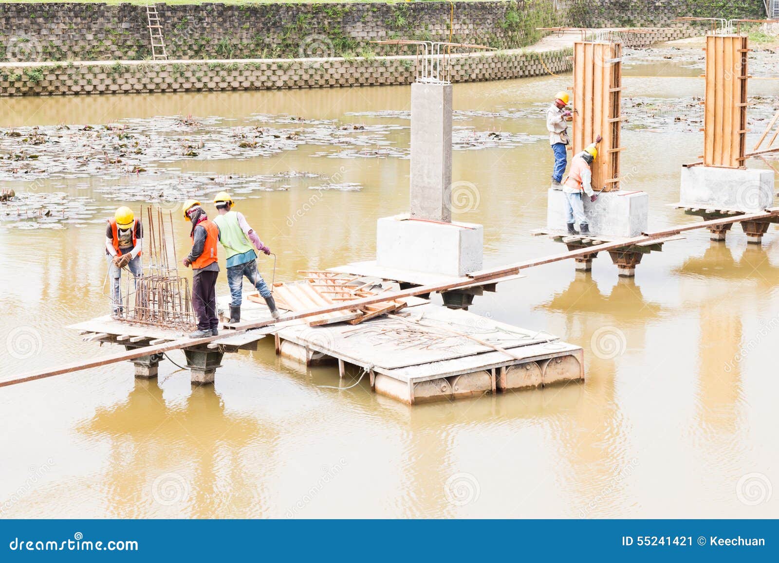 Workers Building Bridge Foundation Across Lake Stock Photography ...