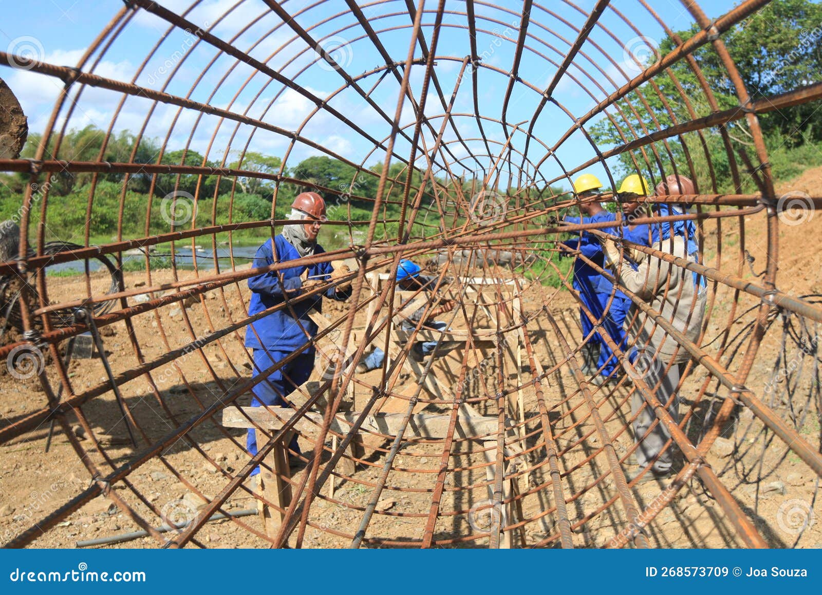 Workers building bridge editorial stock image. Image of backhoe - 268573709