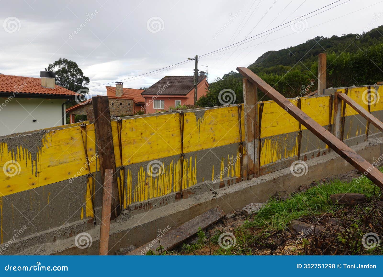 Workers Building Concrete Wall Using Wooden Formwork in Rural Setting ...