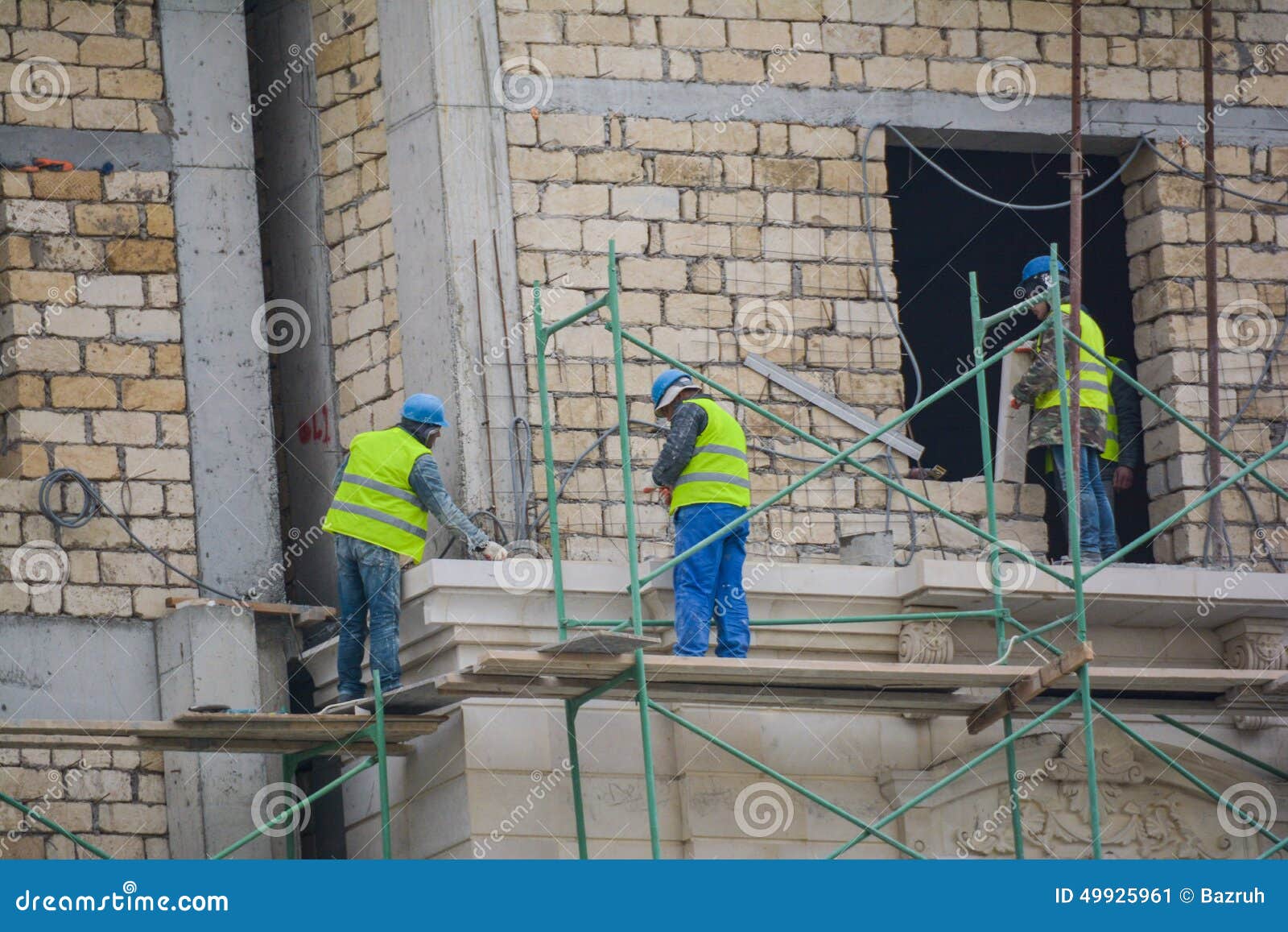 Working builders editorial photo. Image of builders, facing - 49925961