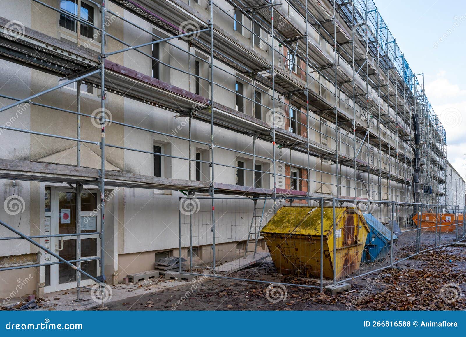 Workers on a Building with Scaffolding and Container Stock Photo ...