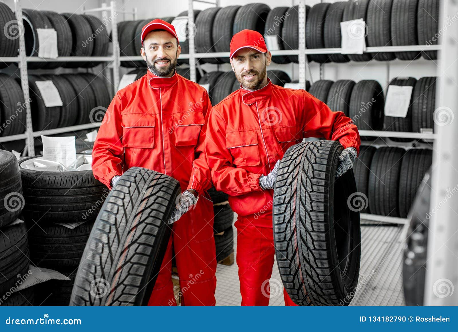 Workers with Car Tires at the Warehouse Stock Photo - Image of ...