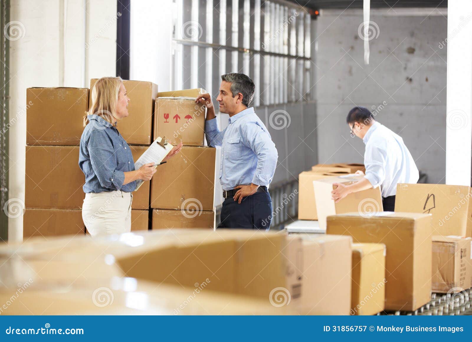 Workers Checking Goods on Belt in Distribution Warehouse Stock Image ...