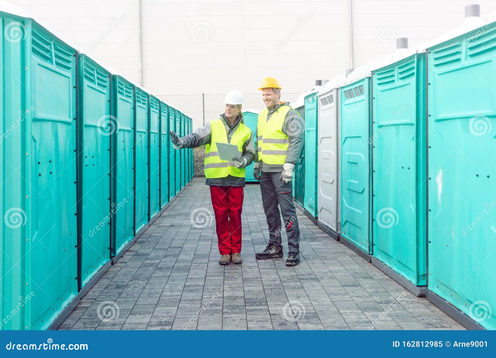 Workers Checking the Portable Toilets for Rental Stock Image - Image of ...