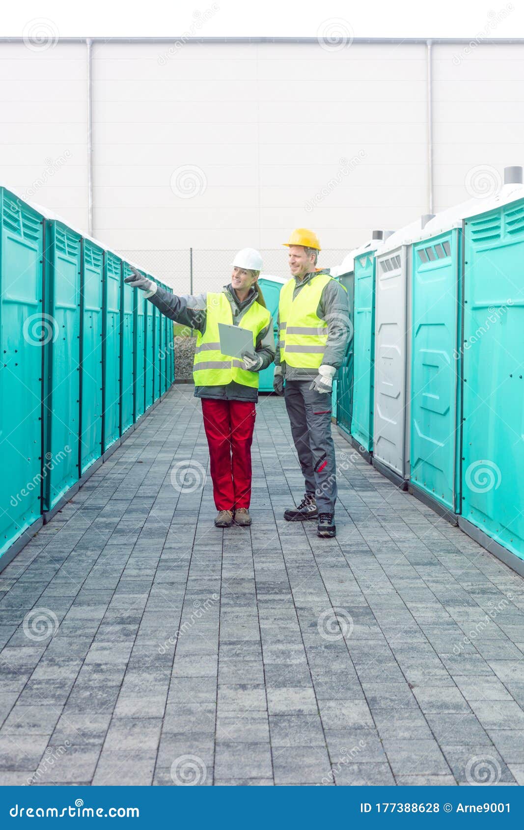 Workers Checking the Portable Toilets for Rental Stock Photo - Image of ...