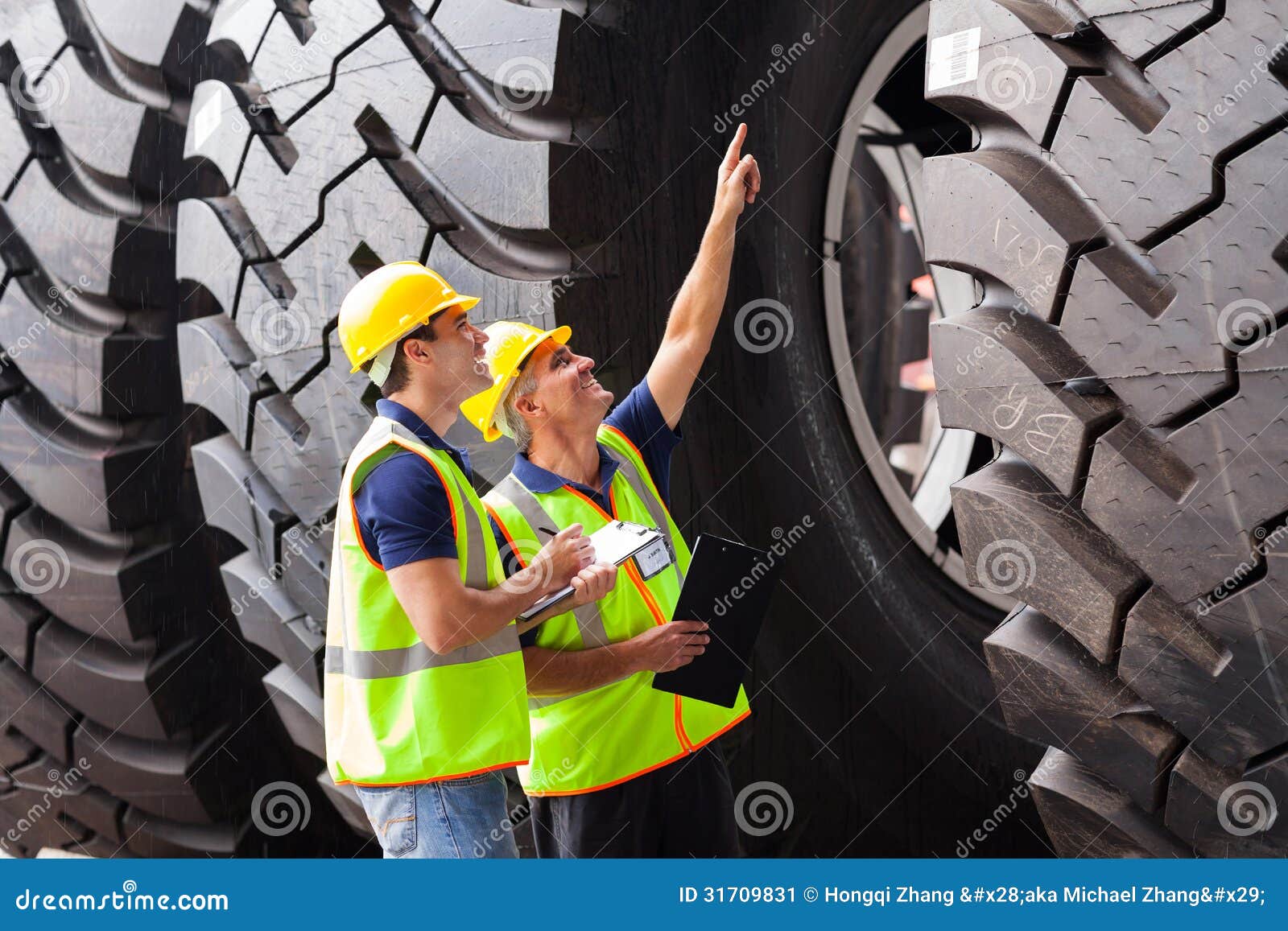 Workers checking tires stock image. Image of handsome - 31709831