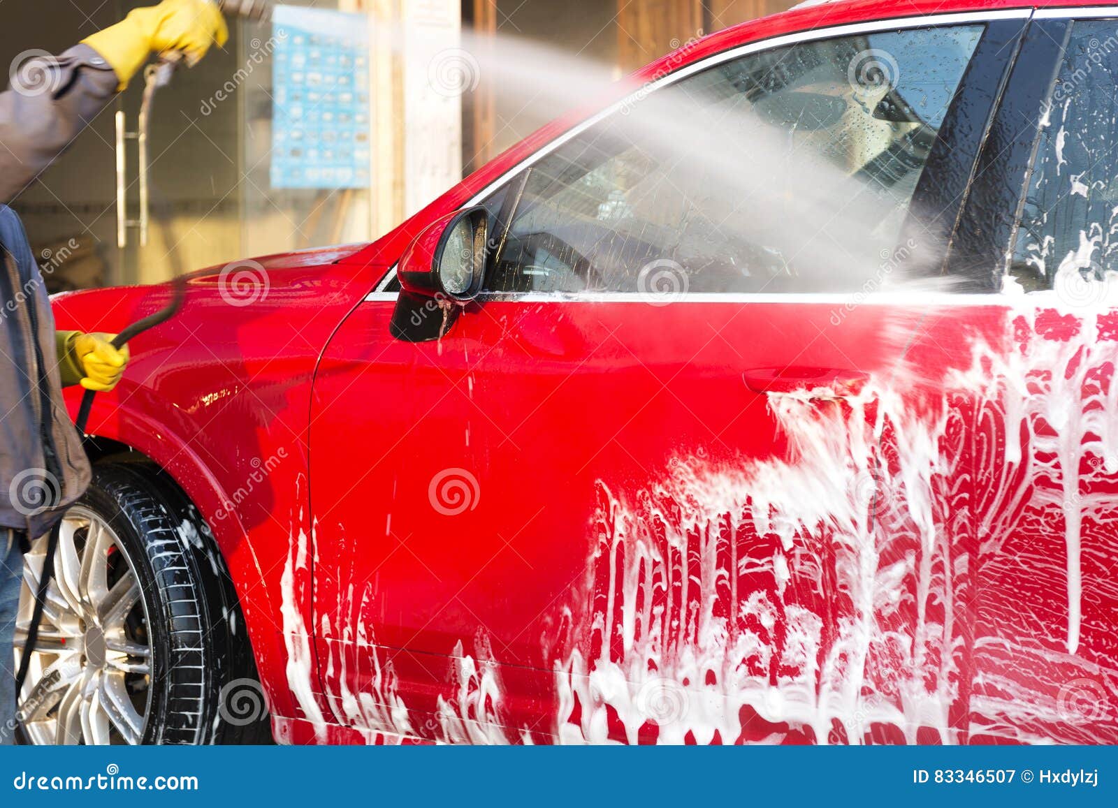 Workers clean the red car stock image. Image of transportation - 83346507