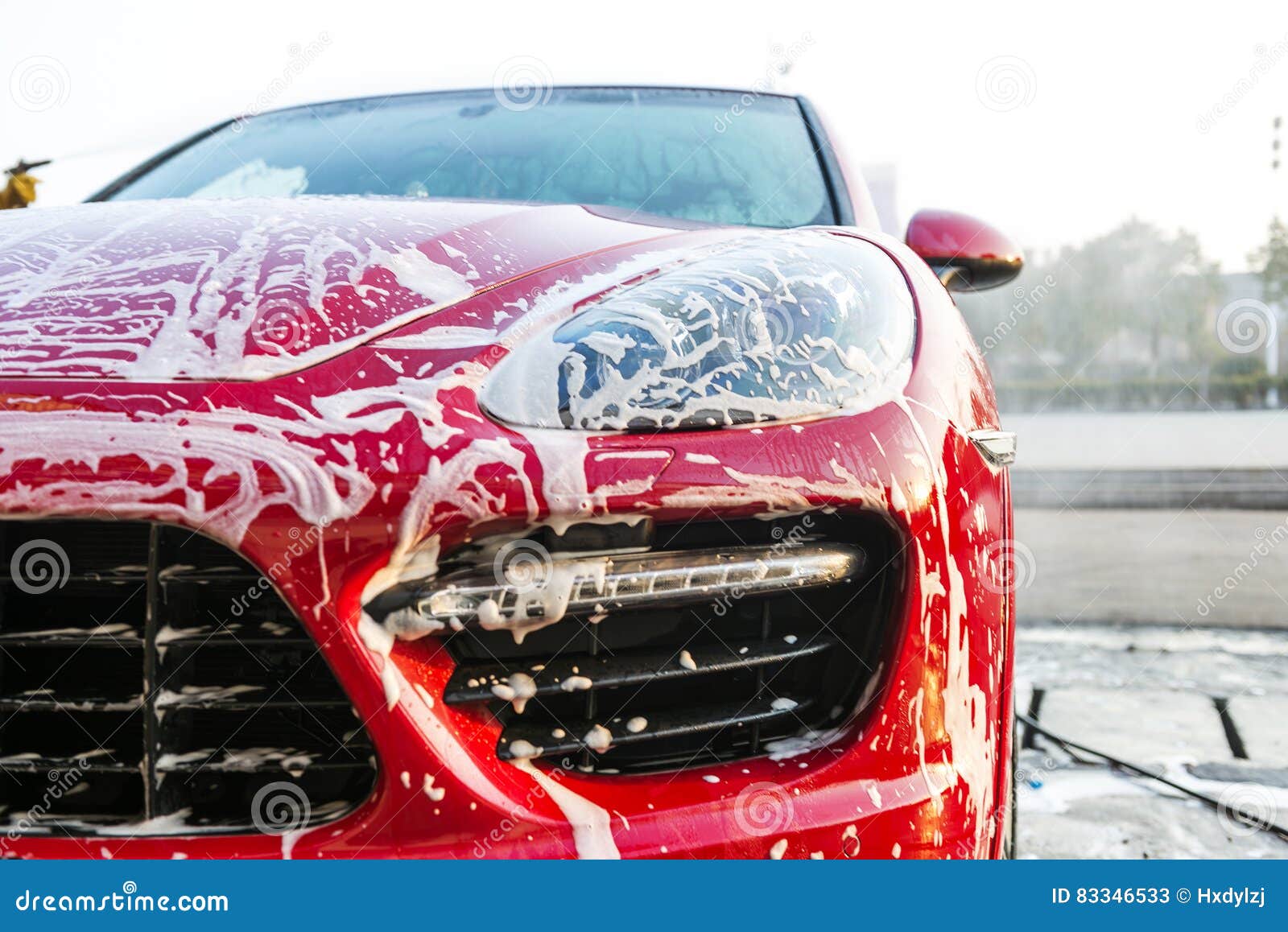 Workers clean the red car stock image. Image of glass - 83346533