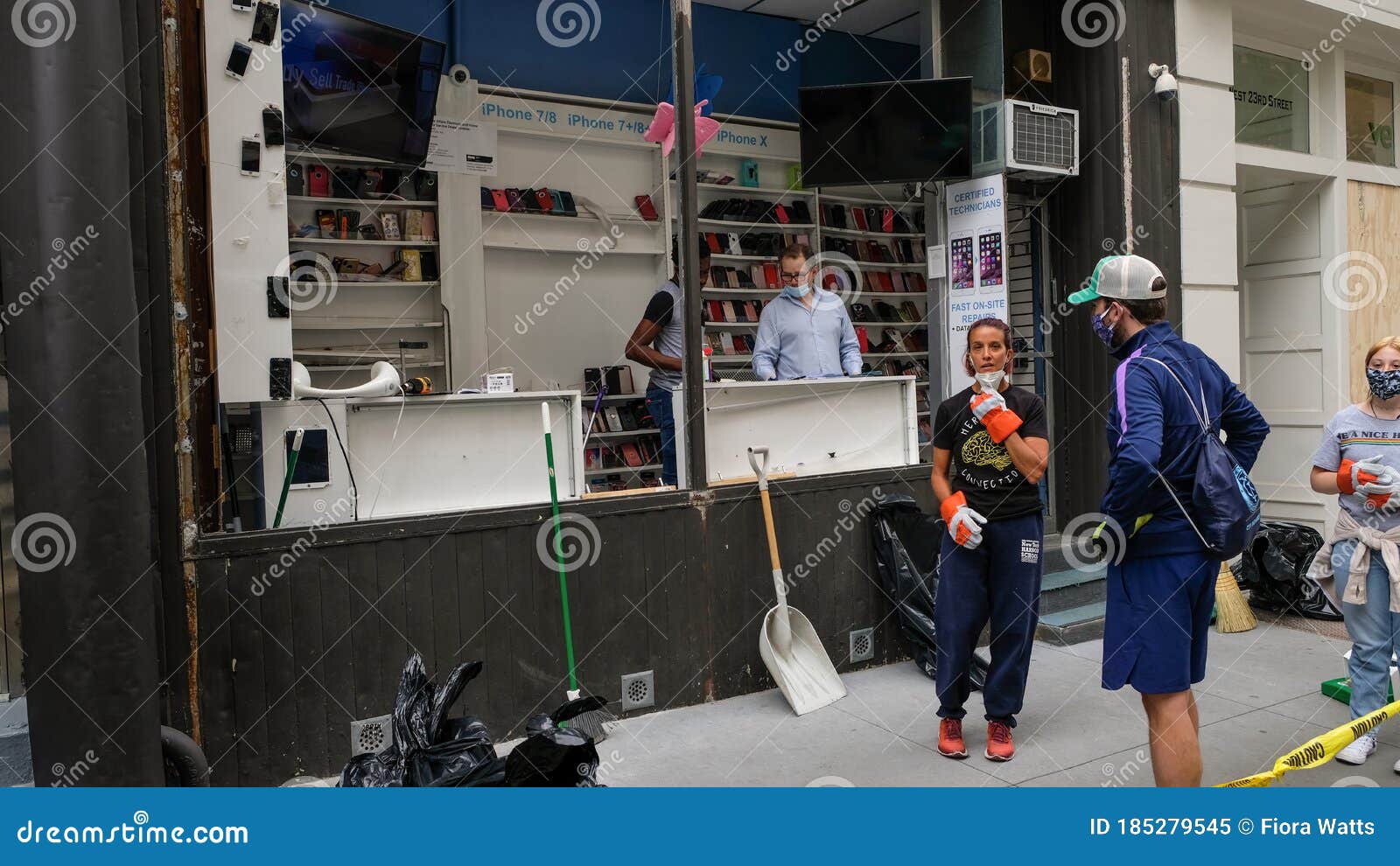 Workers Clean Up a Storefront after it Has Been Vandalized Editorial ...
