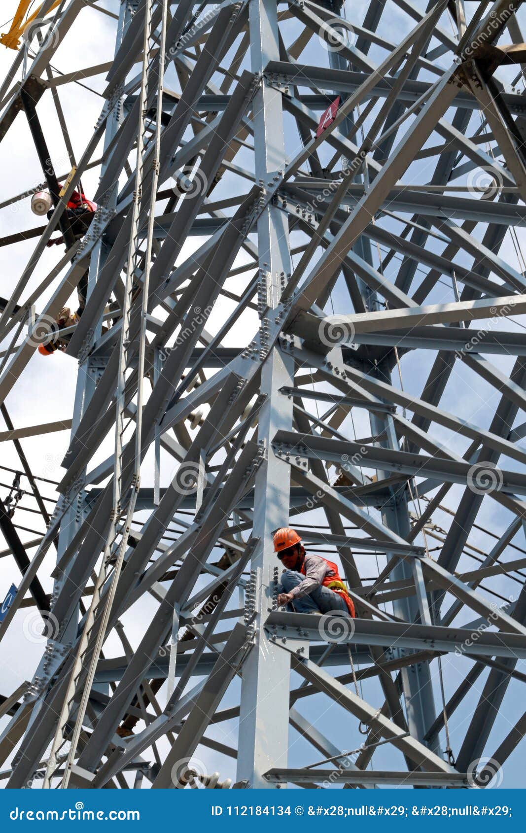 Workers Climb As Work on High Voltage Electric Post. Editorial Stock ...