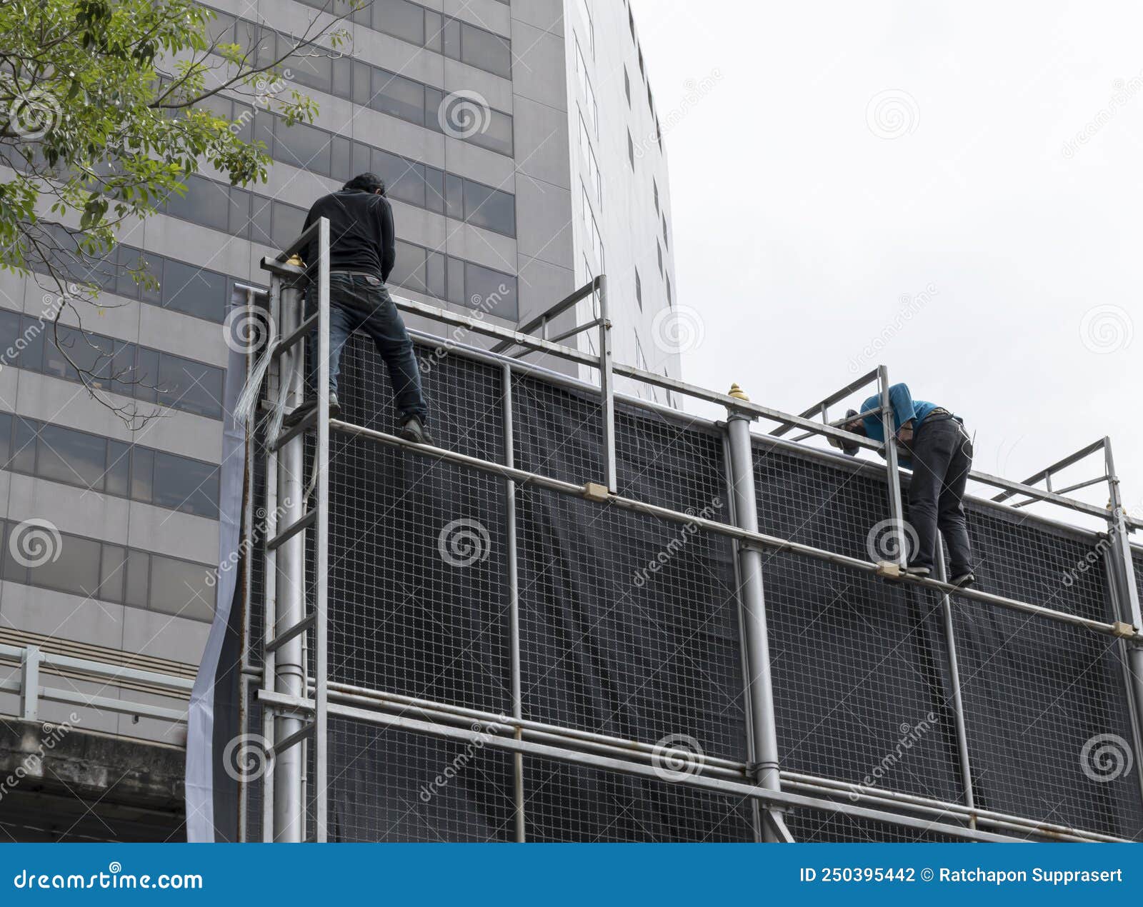 Workers Climb Billboard Structures To Install Billboards Stock Photo ...