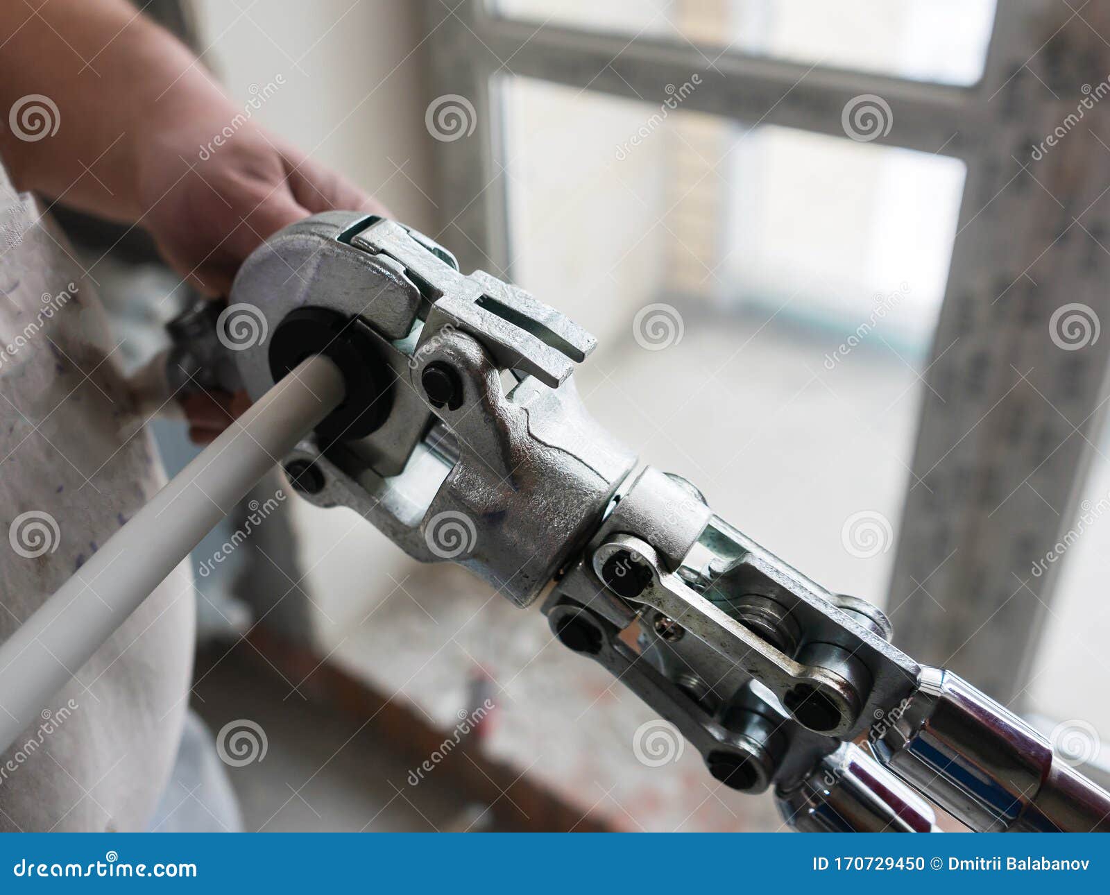 Workers Connecting Pipes with a Tap in the Apartment. Use Plumbing ...