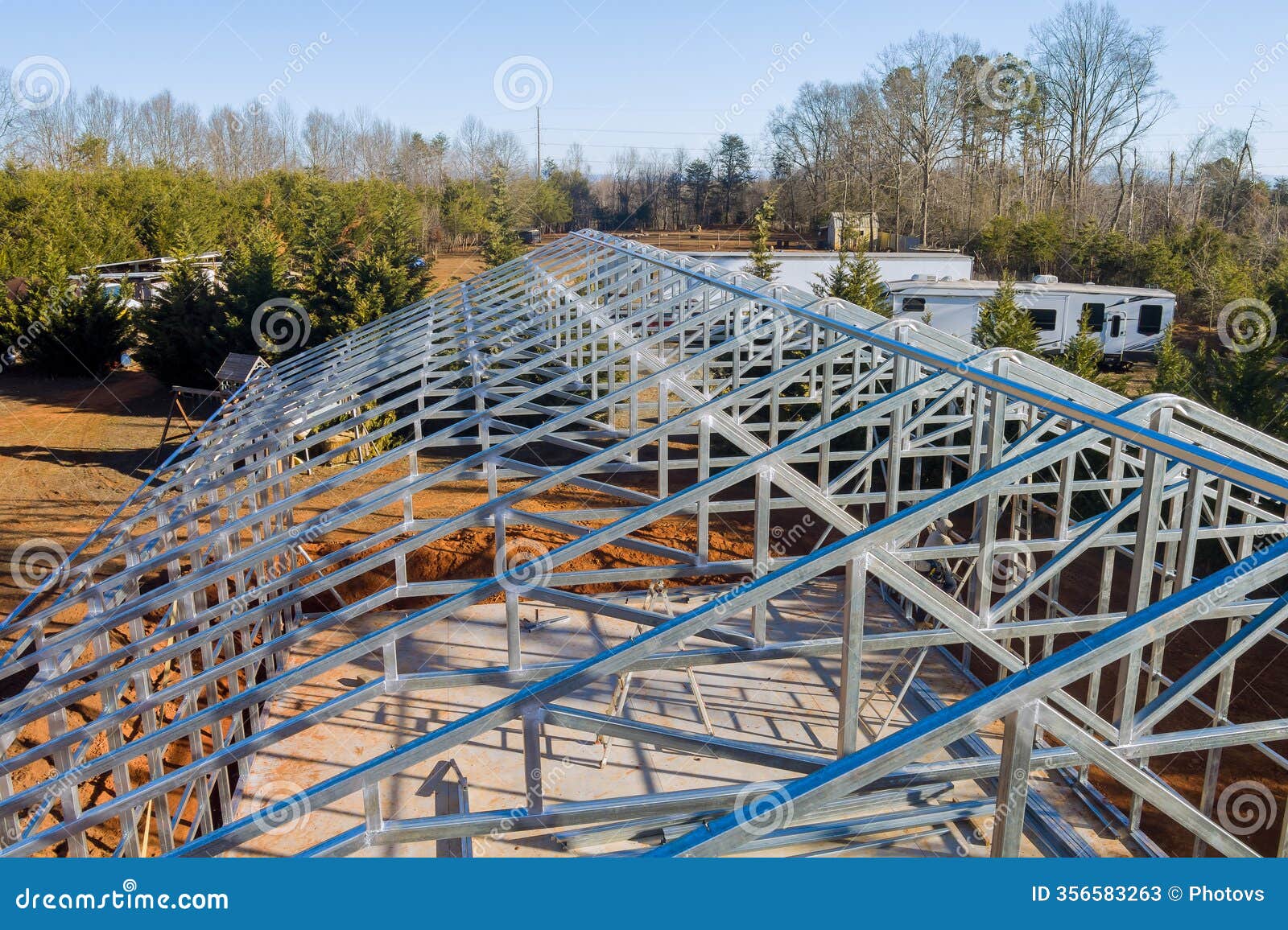 Construction of a Metal Roof Framework in a Rural Area during a Clear ...