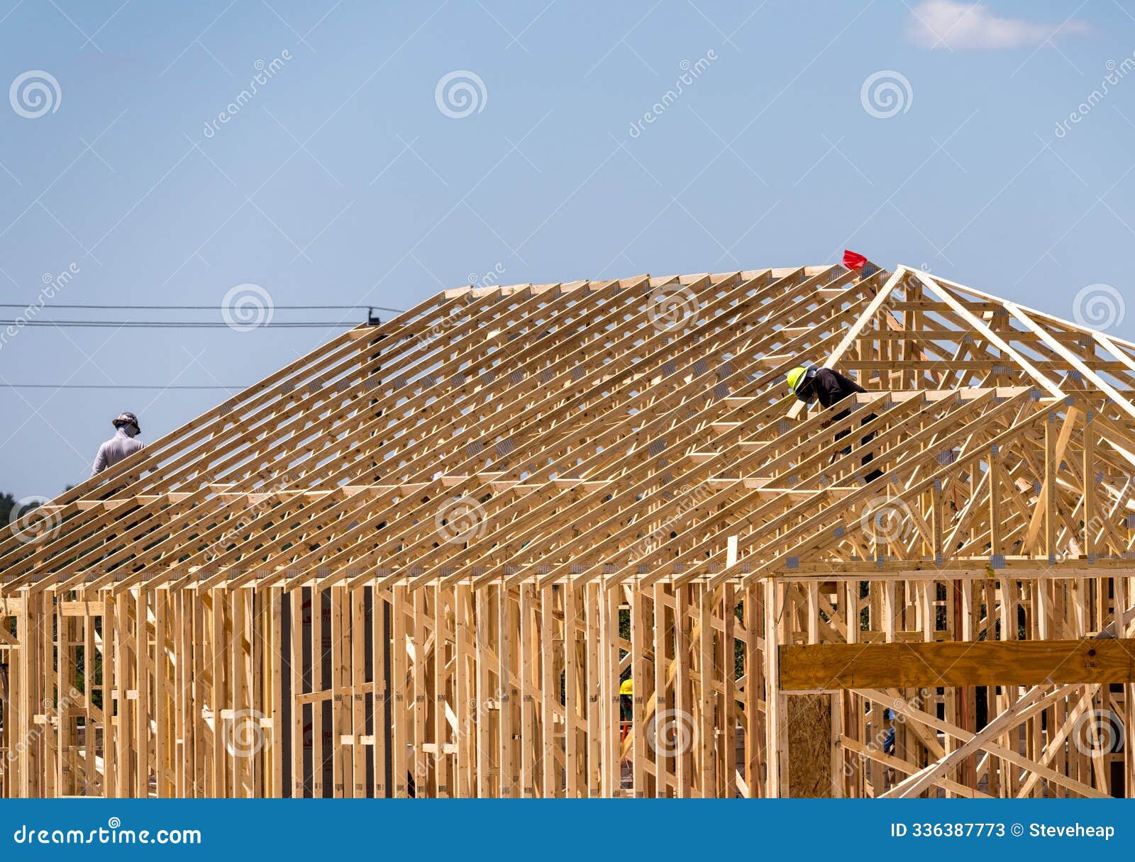 Workers Constructing the Dimensional Lumber Roof Structure for Single ...