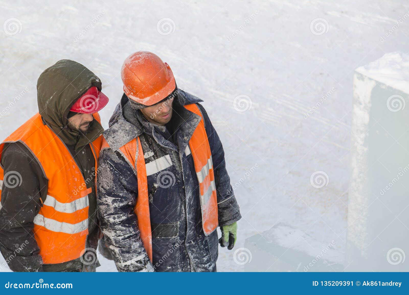 Three Workers Talking on the Construction Site Stock Image - Image of ...