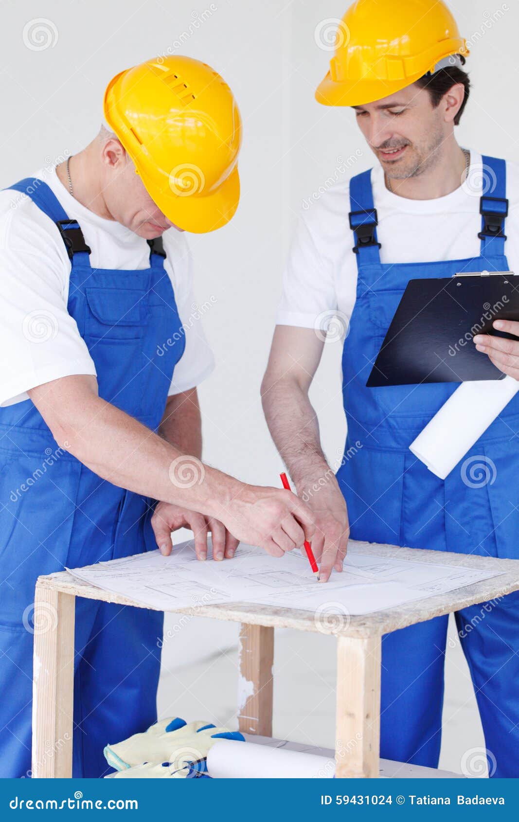 Workers with Construction Plan Stock Photo - Image of working ...
