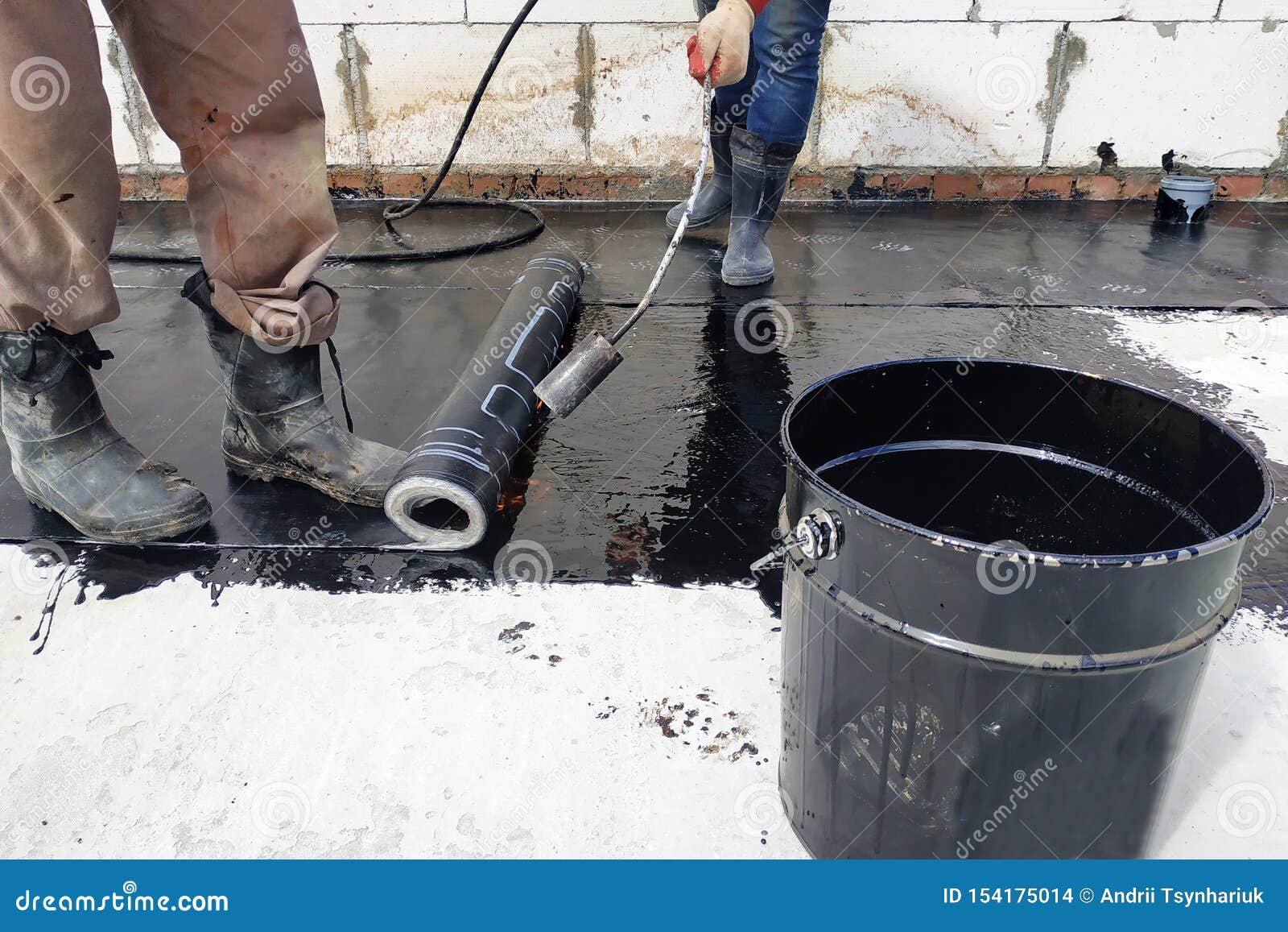 The Workers Cover the Concrete Screed with Bituminous Liquid Solution ...