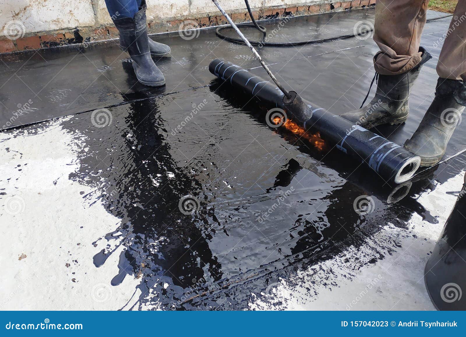 The Workers Cover the Concrete Screed with Bituminous Liquid Solution ...