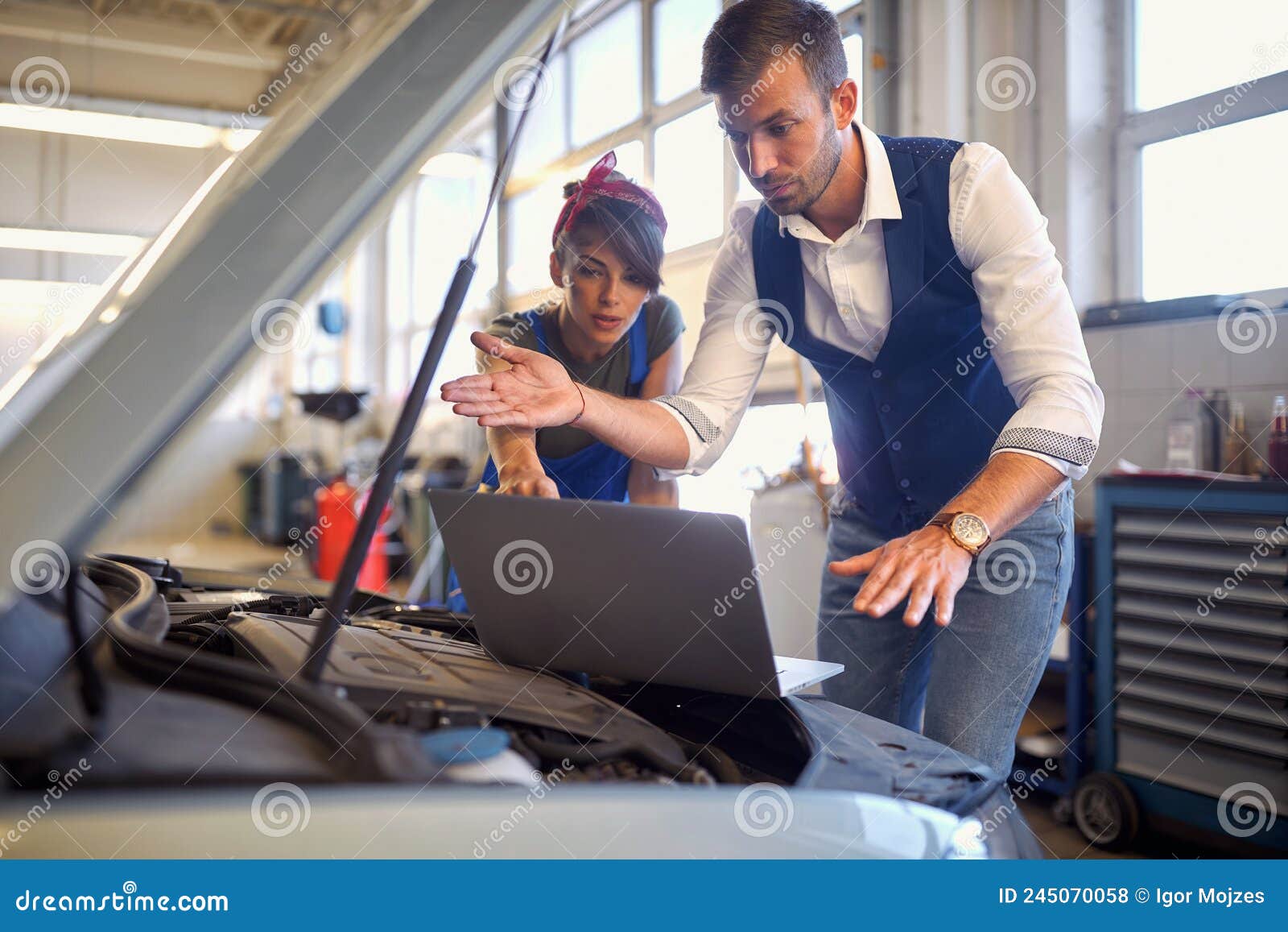 Workers Detect Problem with Car in Car Service Stock Photo - Image of ...