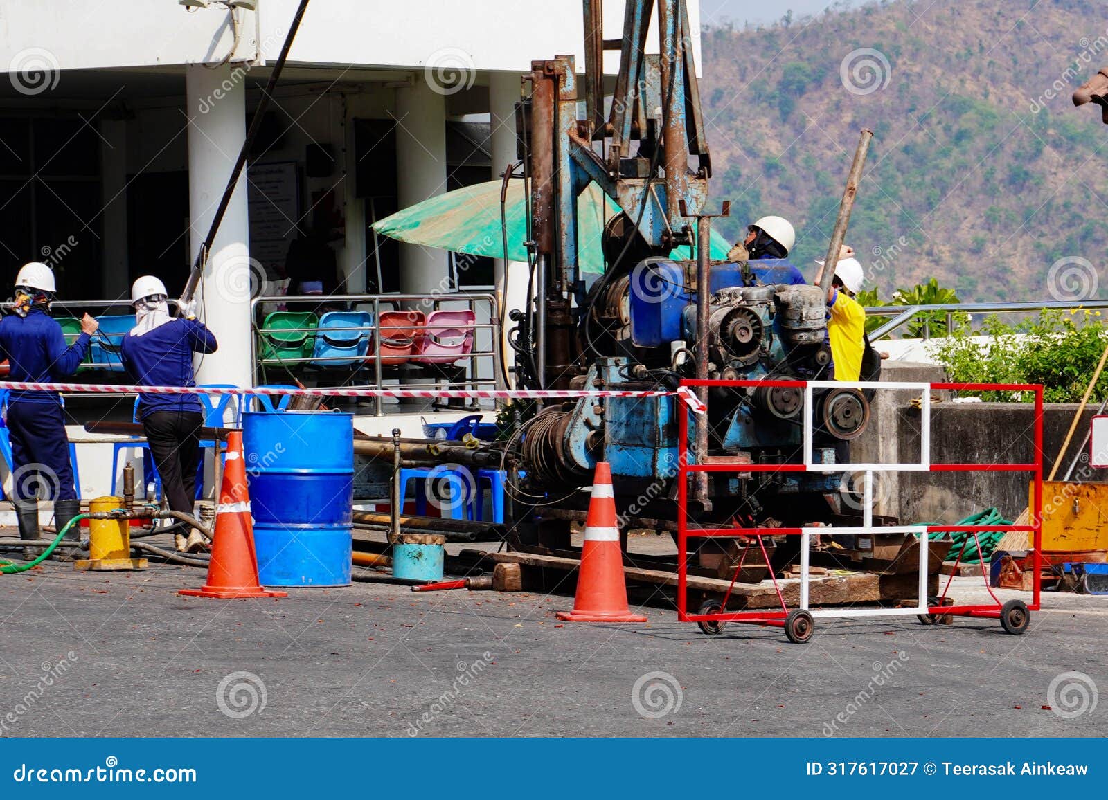 Workers are Digging Drilling of the Earth for Pipe Replacement, Sewer. Work with Drainage System ...