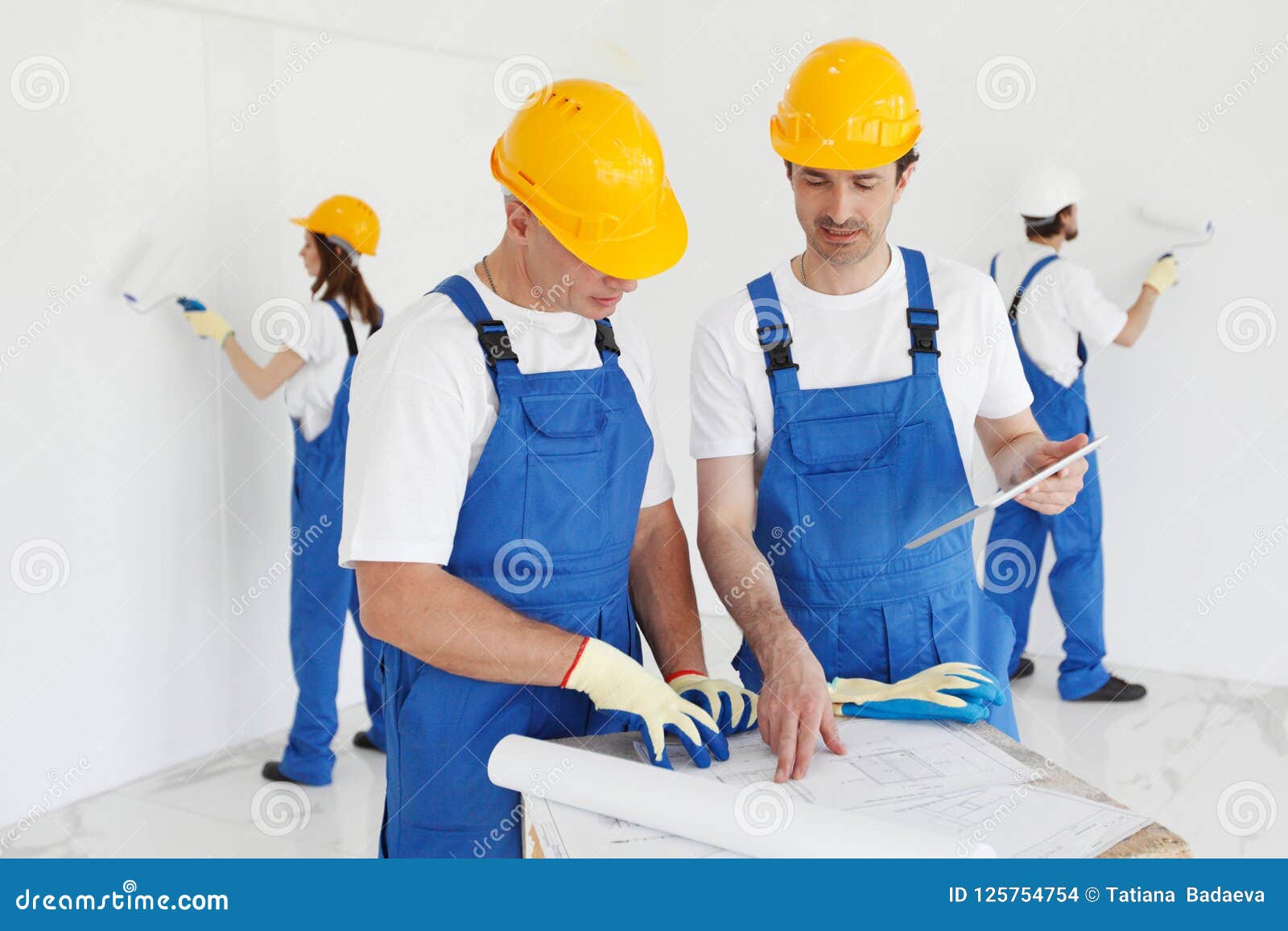 Workers Discuss Renovation Project Stock Photo - Image of apartment ...