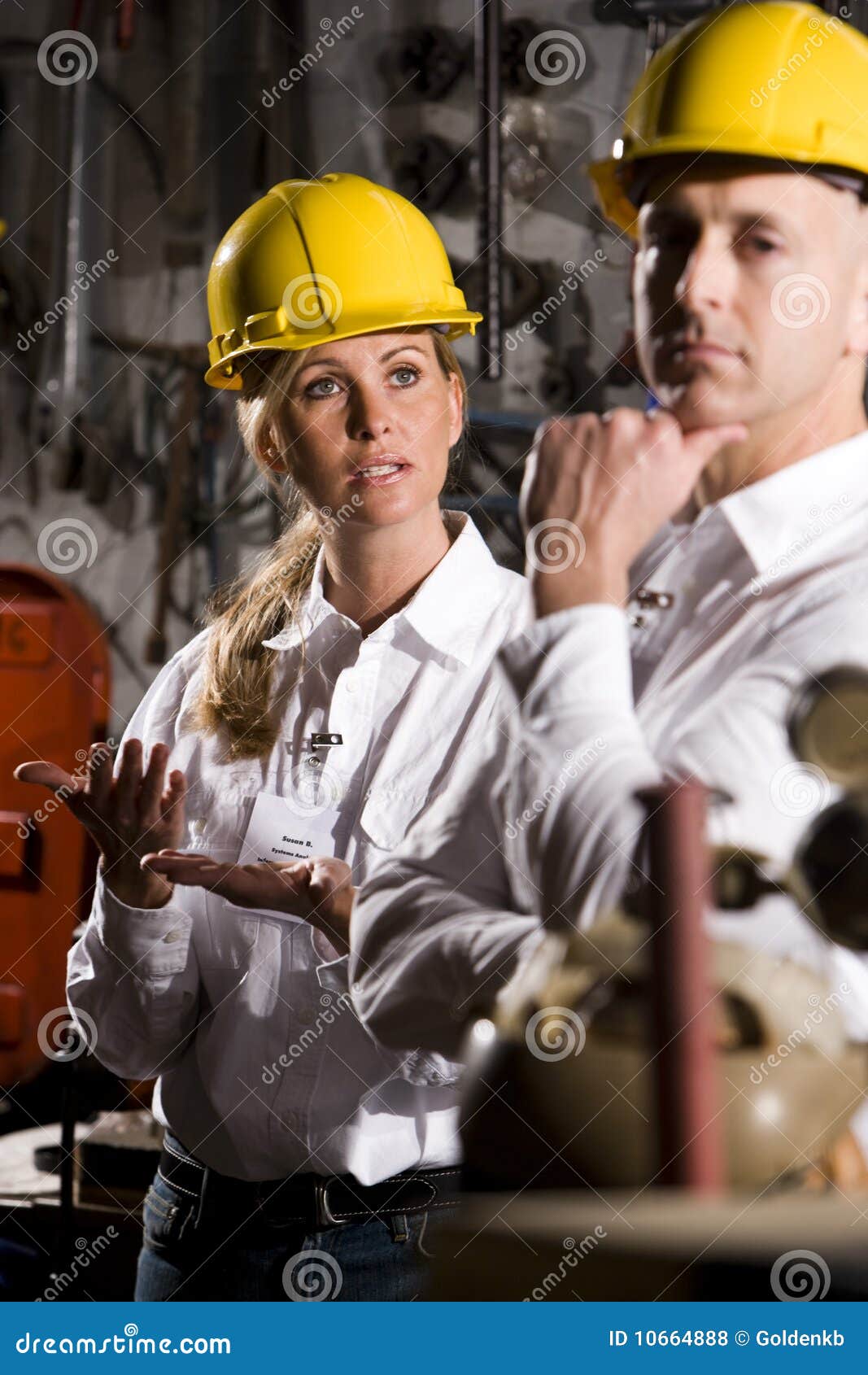 Workers Discussing an Issue Stock Photo - Image of contemplative, hard ...