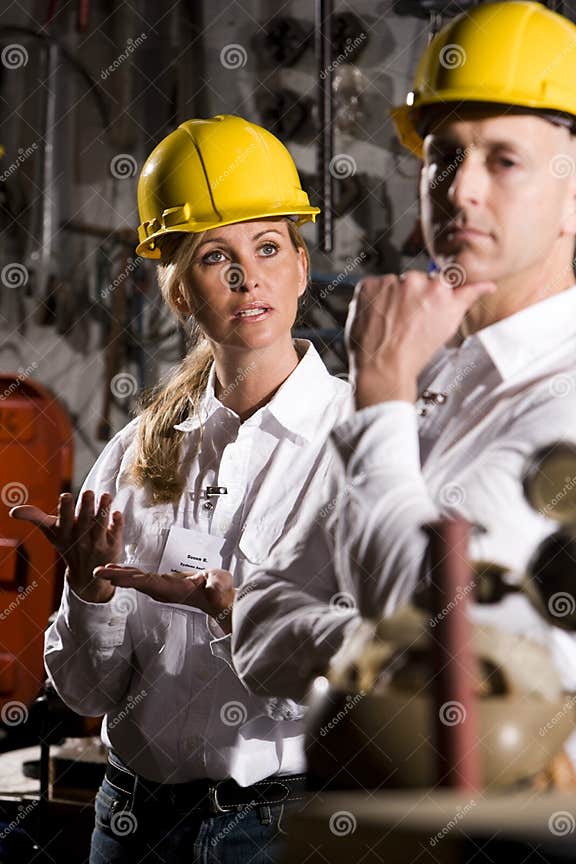 Workers Discussing an Issue Stock Photo - Image of contemplative, hard ...