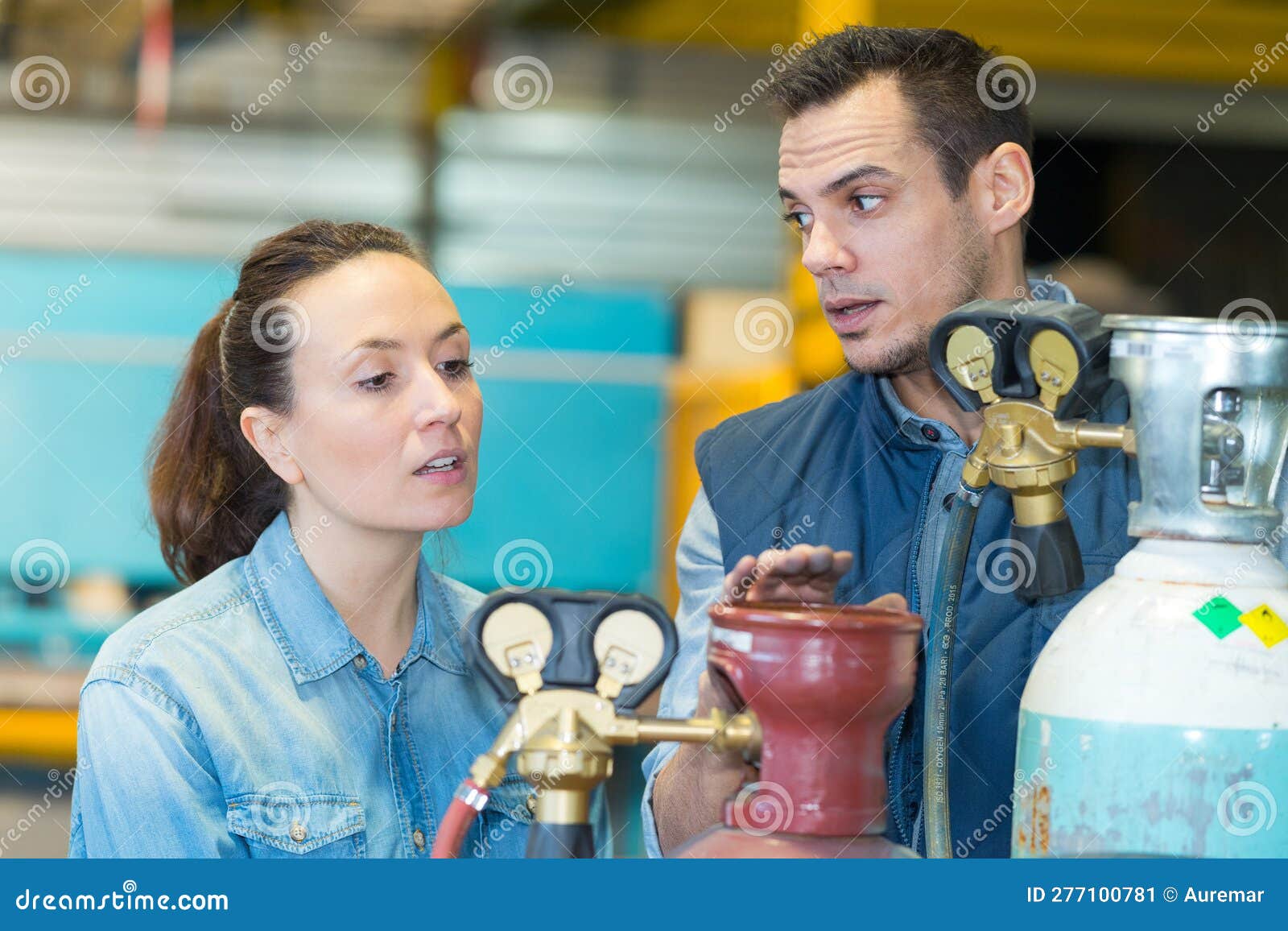 Workers Discussing Next To Oxygen Cylinders Stock Image - Image of ...