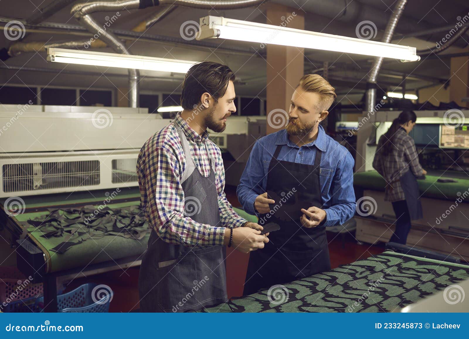 Workers Discussing Production Process Standing at Cutting Machine in ...