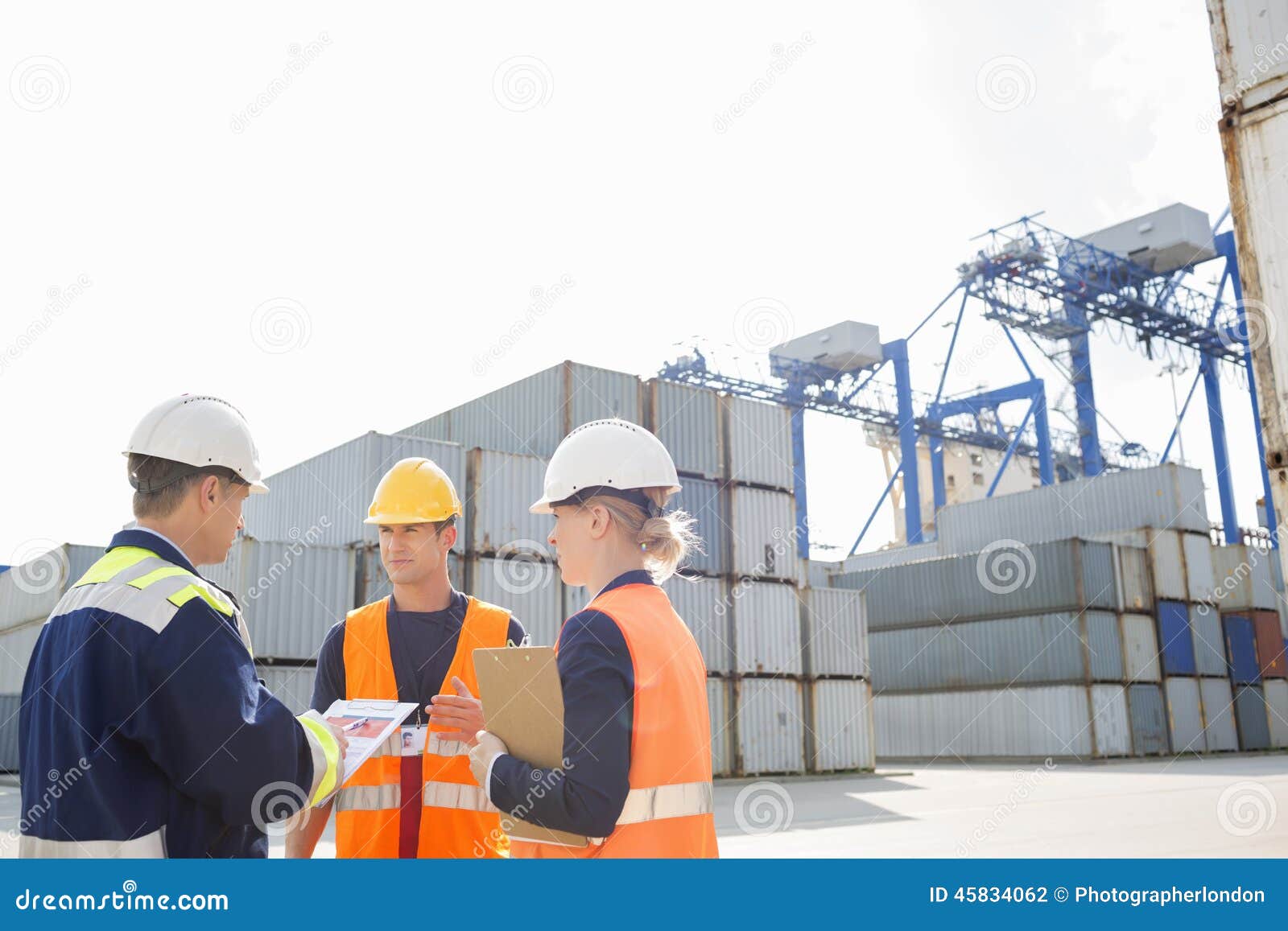 Workers Discussing in Shipping Yard Stock Photo - Image of adult ...