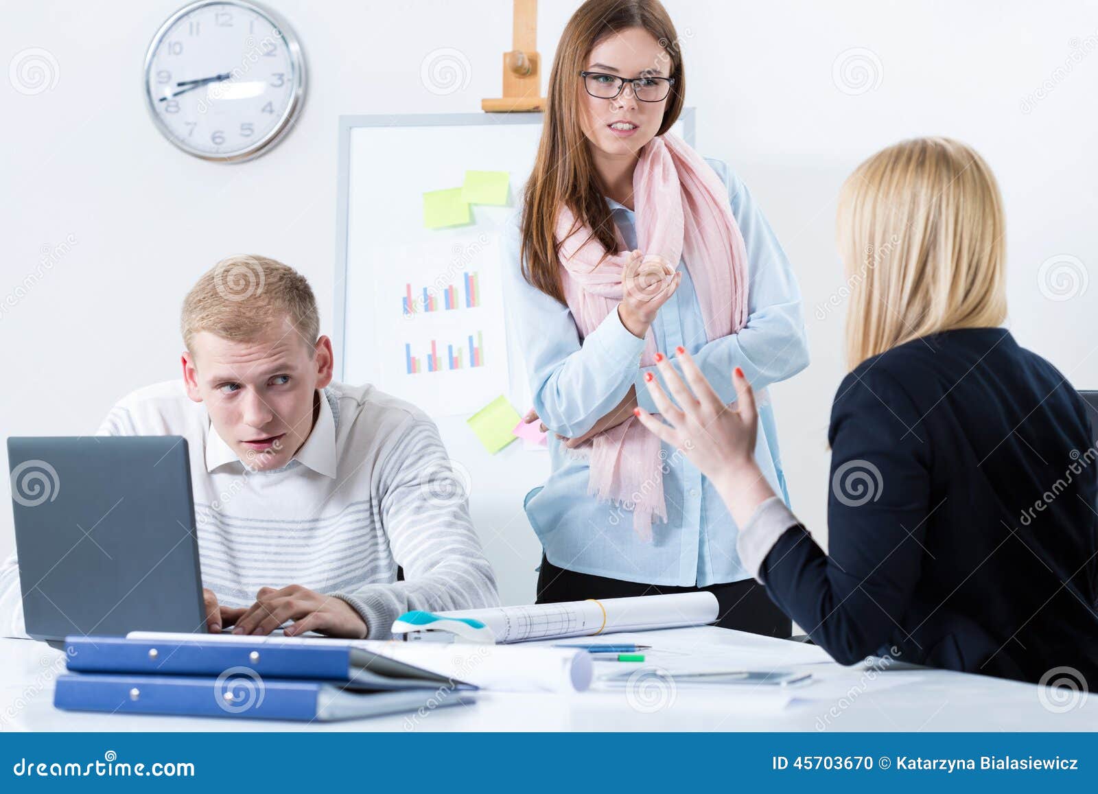 Workers discussing at work stock photo. Image of folders - 45703670