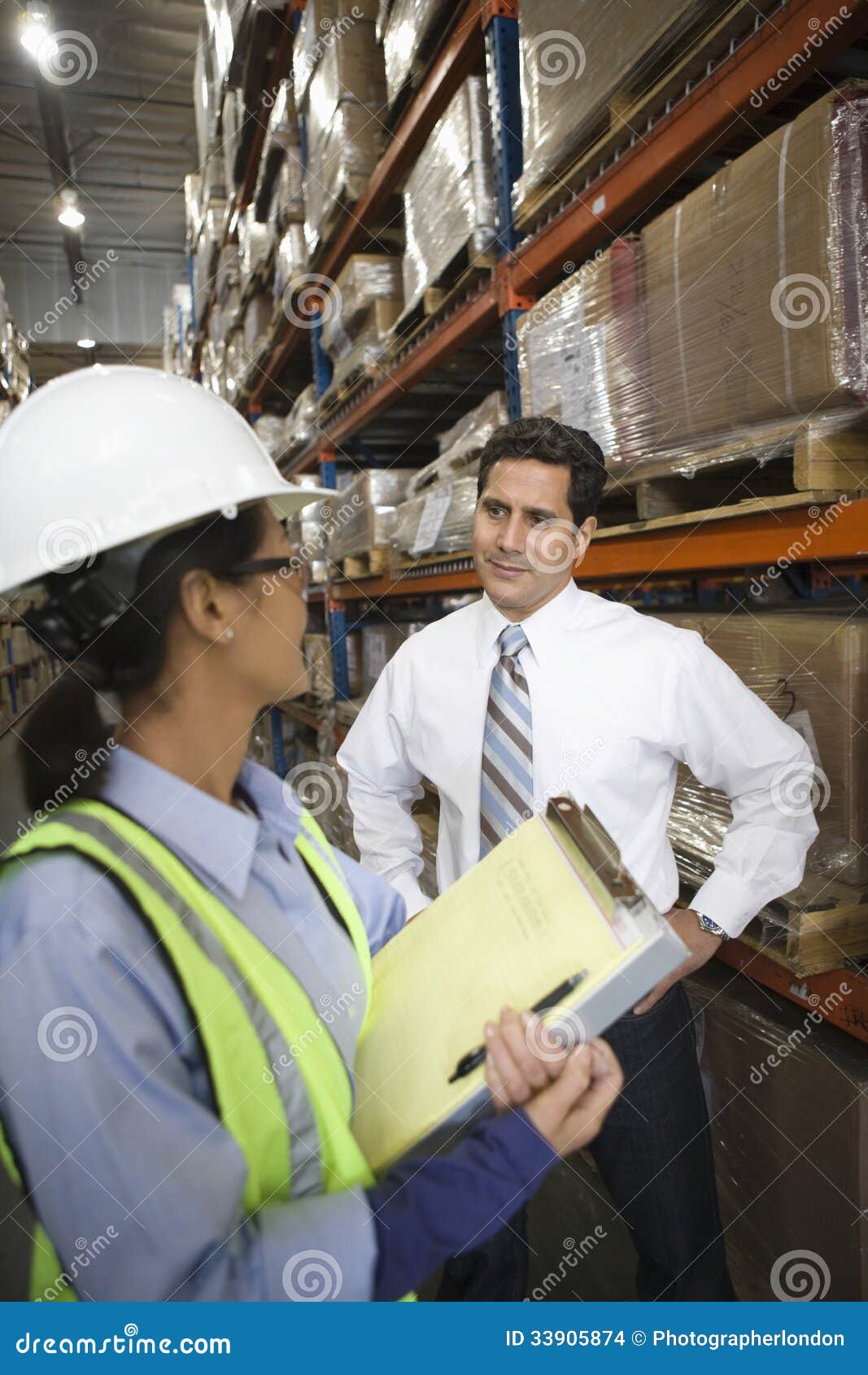 Workers in Discussion at Warehouse Stock Photo - Image of looking ...