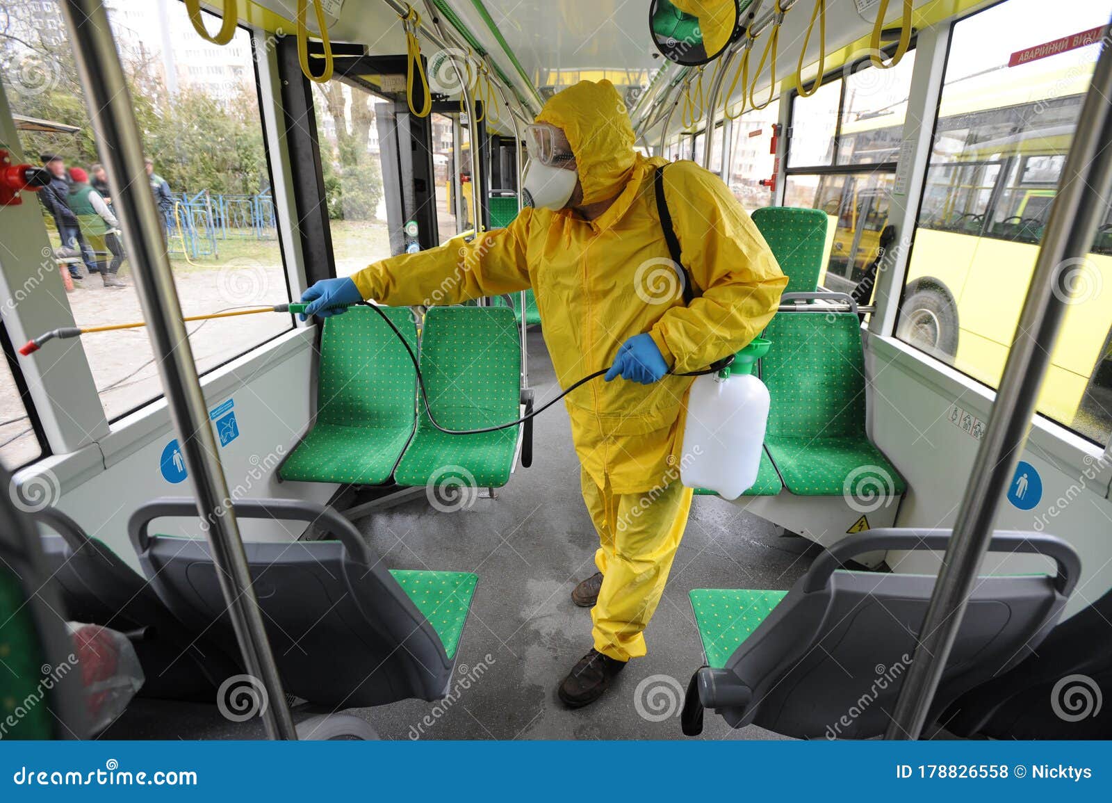Workers disinfecting bus editorial stock photo. Image of covid - 178826558