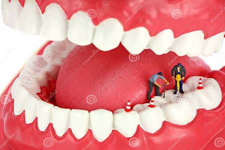 Workers drilling a tooth stock photo. Image of work, figurine - 3382448