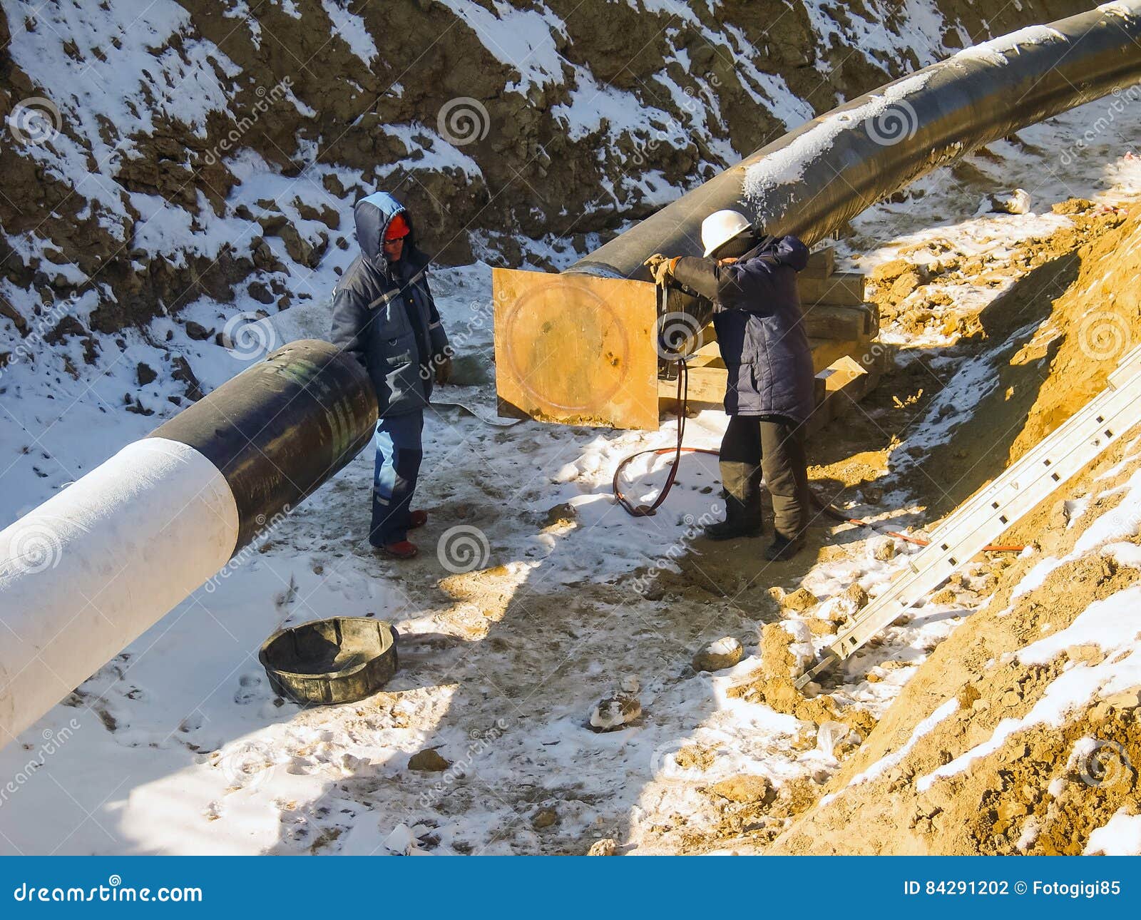 The Workers Engaged in the Construction of the Pipeline. Welders Build ...