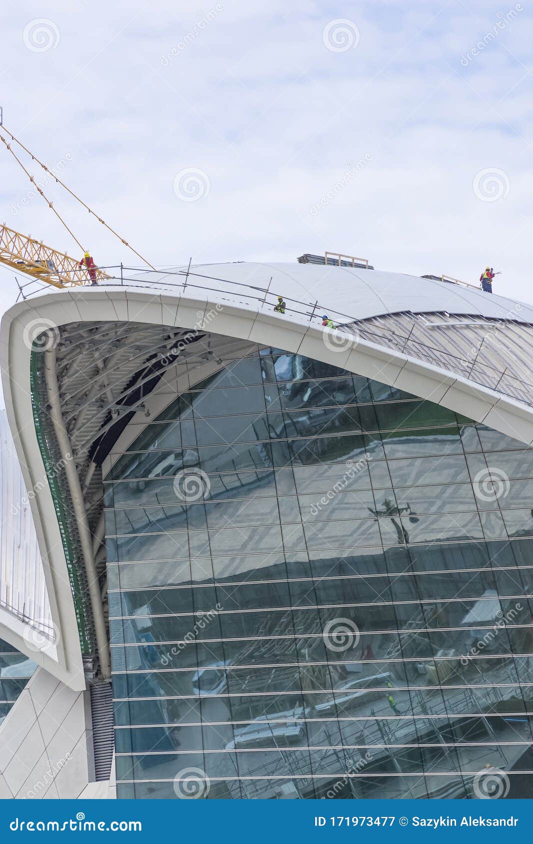 Workers are Engaged in the Installation of the Roof on a High-rise ...