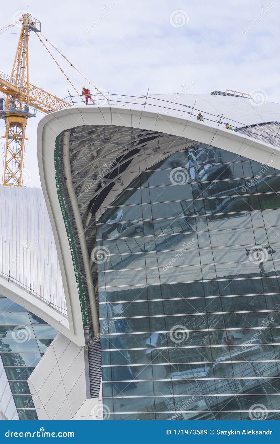 Workers are Engaged in the Installation of the Roof on a High-rise ...