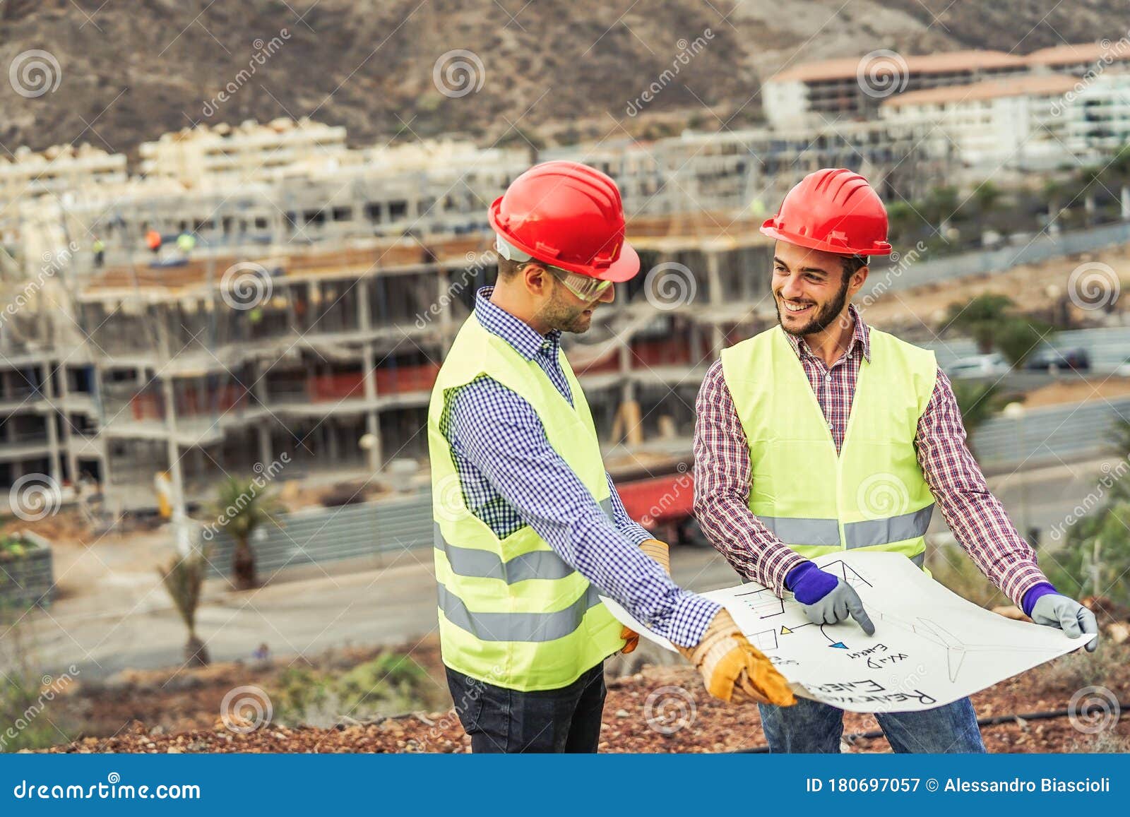 Workers Engineers Discussing about the New Building Area - Young ...