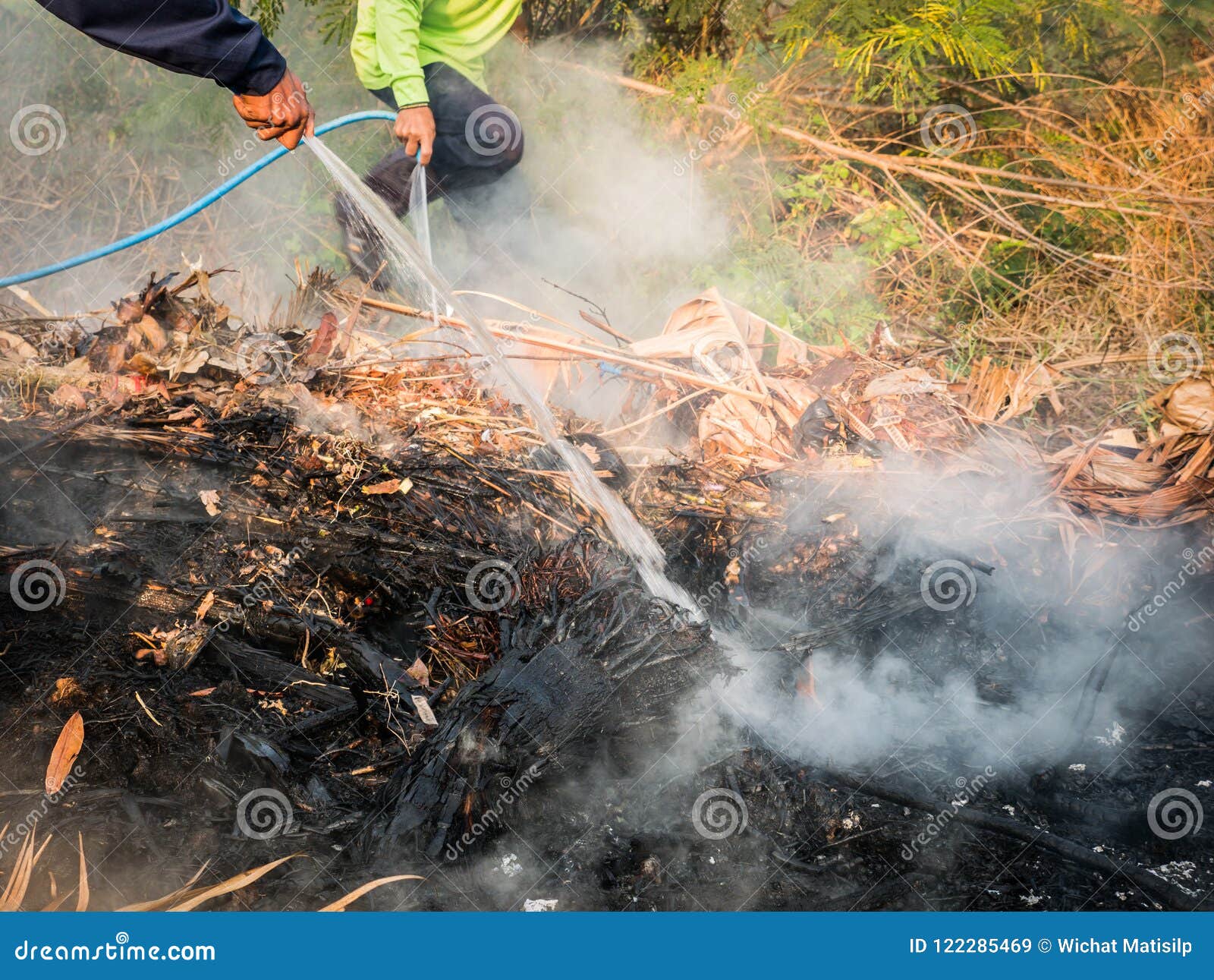 Workers Extinguish Fire with Water Stock Image - Image of intense, pile ...