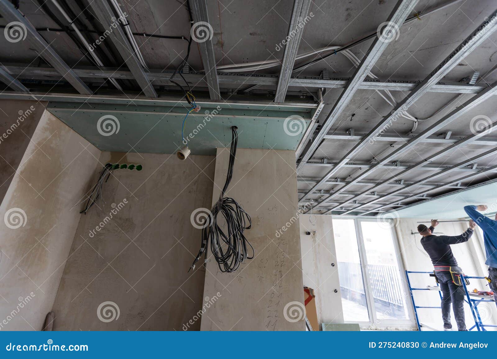 Workers Fitting Panel into Frame of Ceiling. Stock Photo - Image of ...