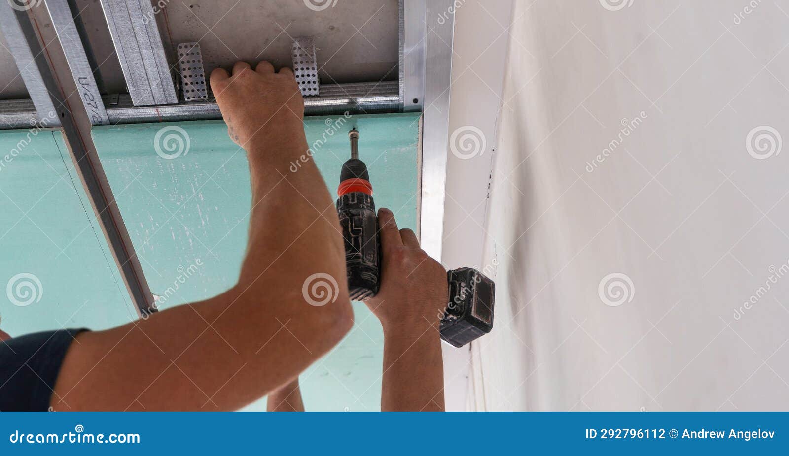 Workers Fitting Panel into Frame of Ceiling. Stock Photo - Image of ...