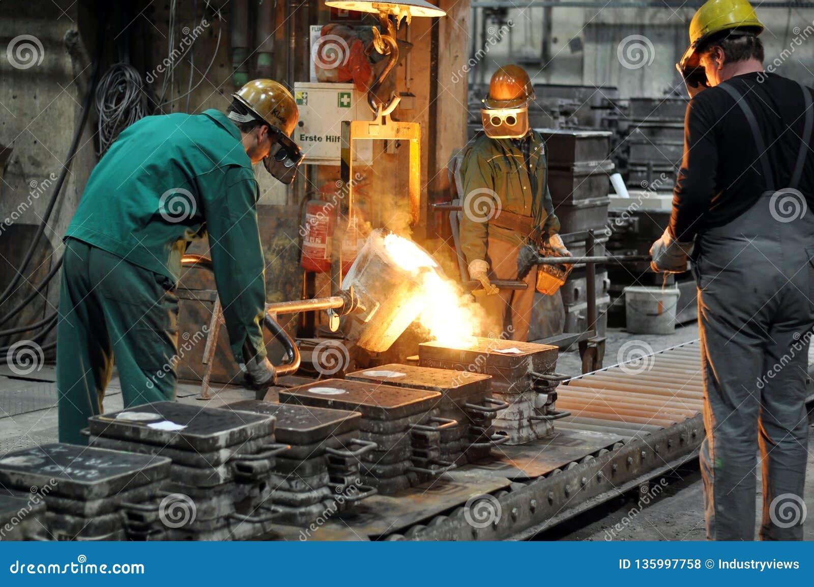 Workers In A Foundry Casting A Metal Workpiece - Safety At Work And ...