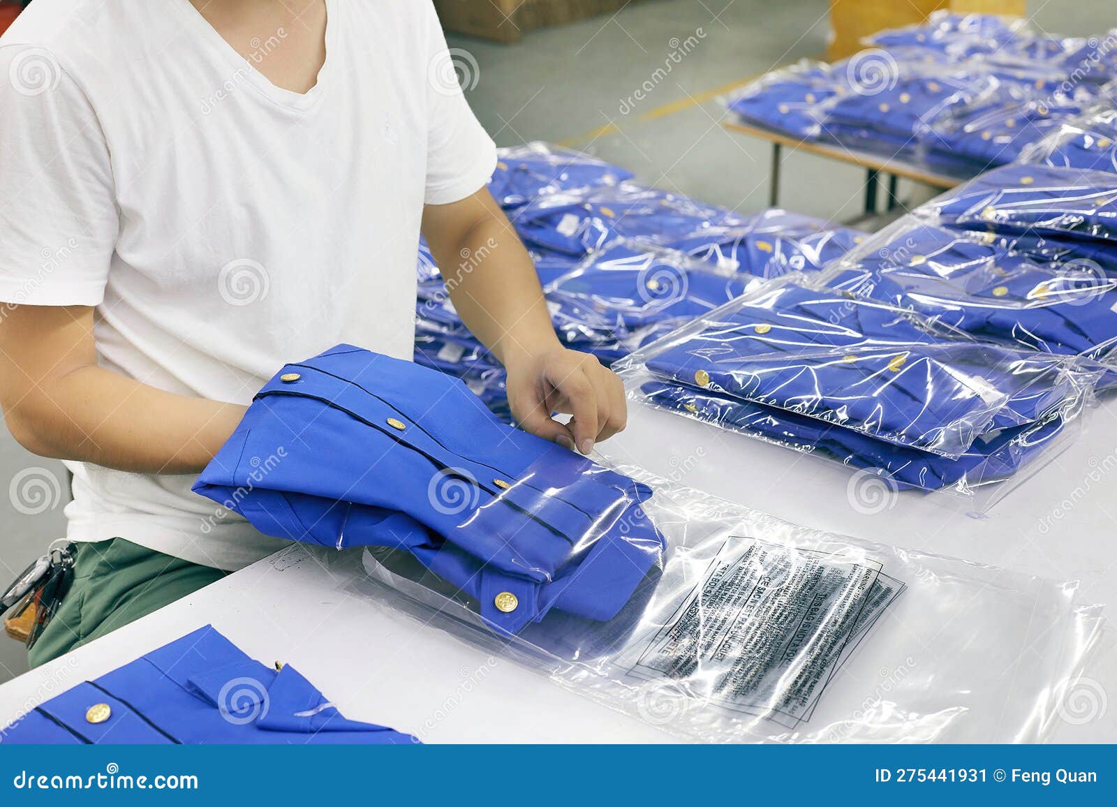 Workers in a Garment Factory are Loading and Sorting Clothes Stock ...
