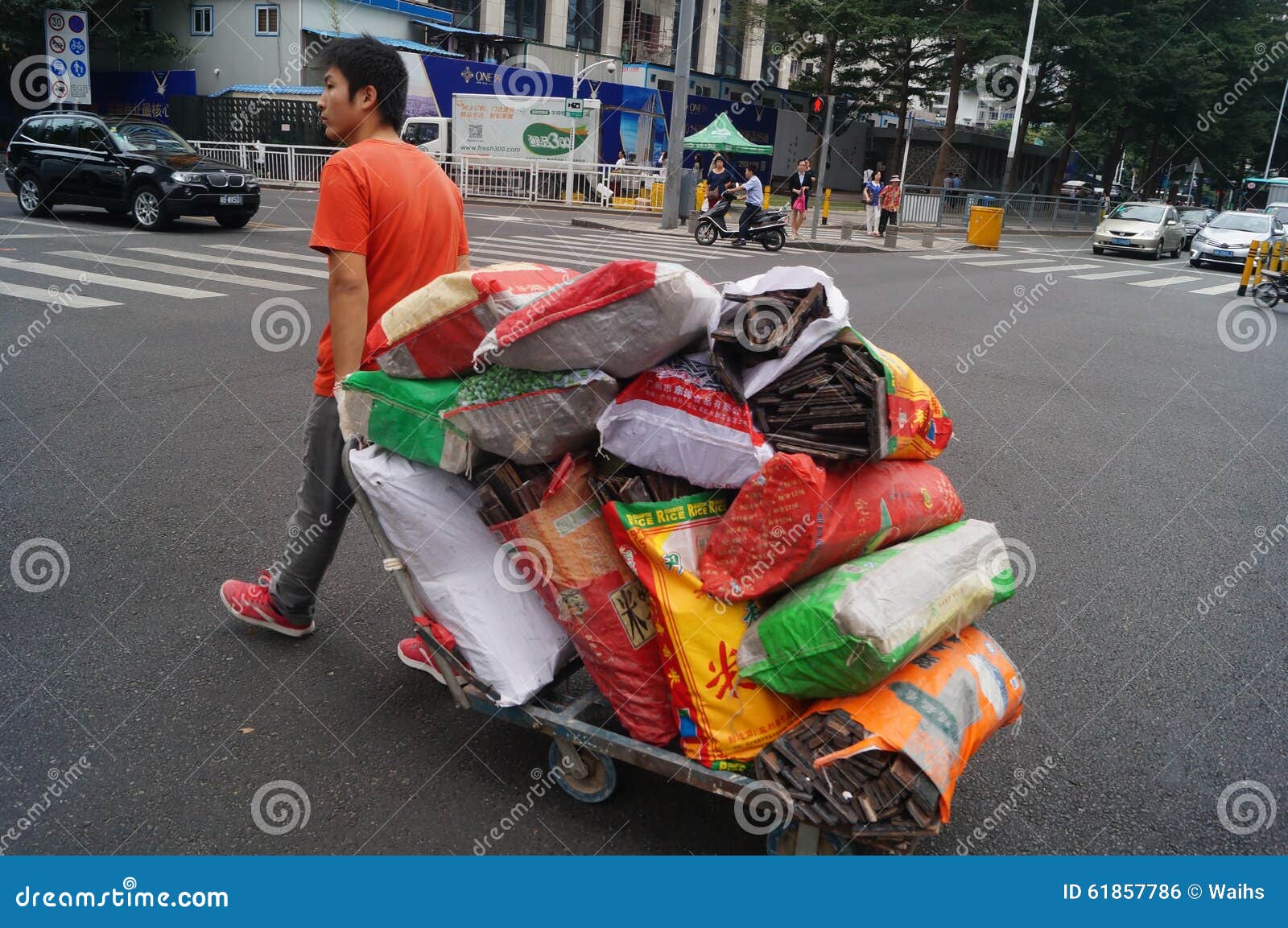 Workers hauling goods editorial photo. Image of buildings - 61857786